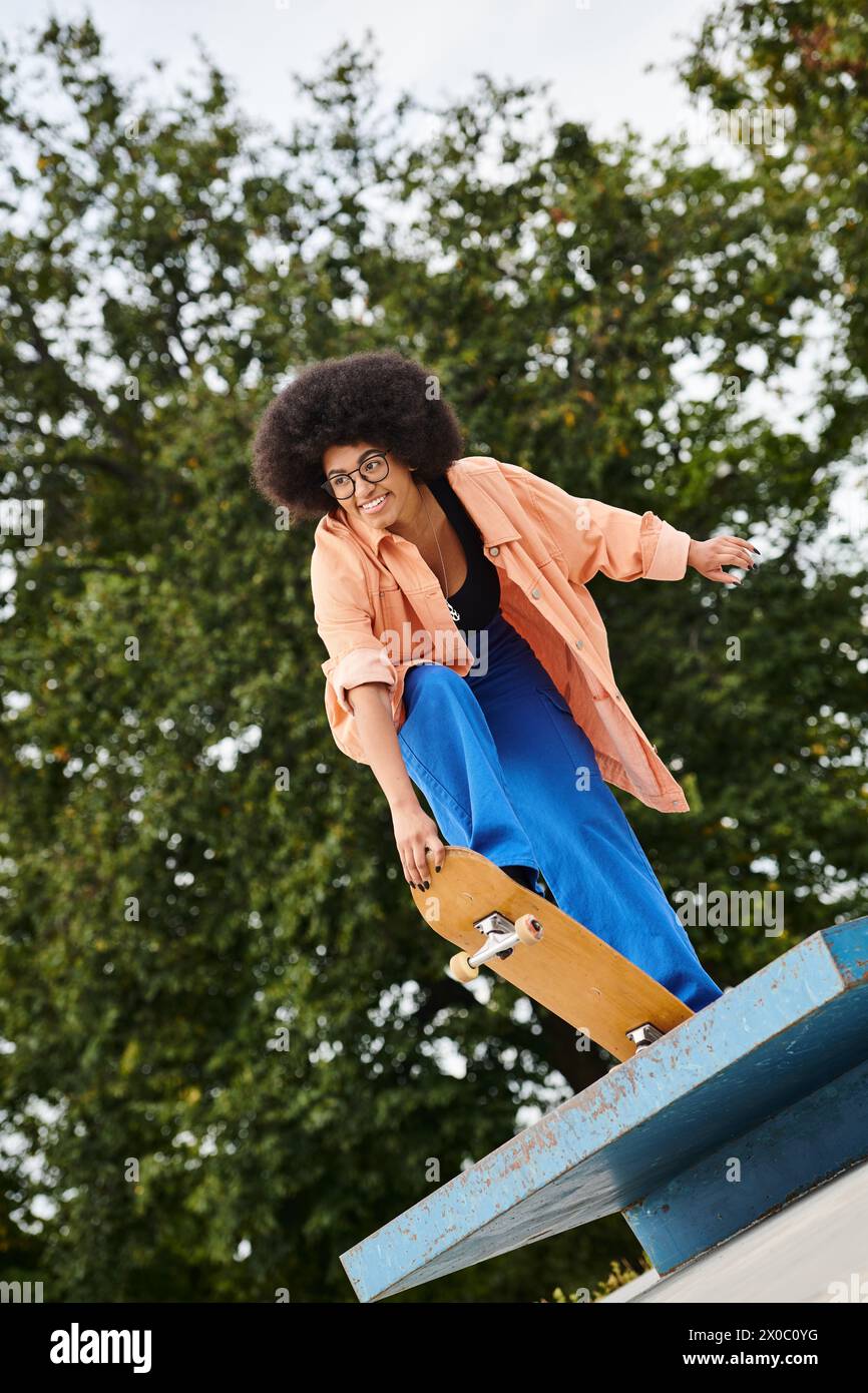 black woman effortlessly glides down a skateboard ramp with skill and ...