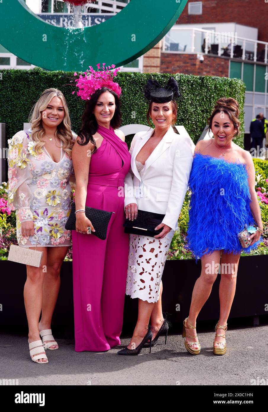 Racegoers pose for a photograph on day one of the 2024 Randox Grand ...