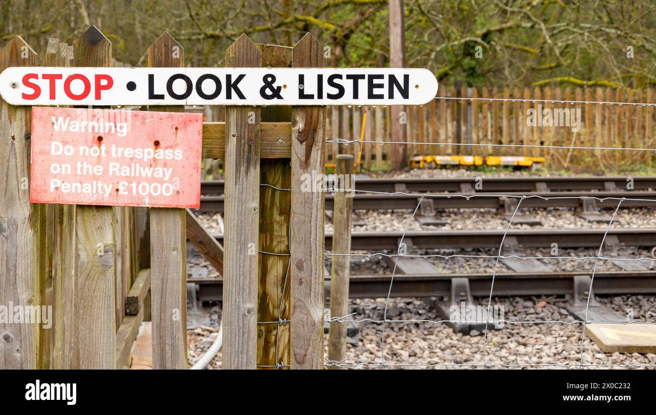 stop look listen sign, warning the public to be aware when crossing a ...