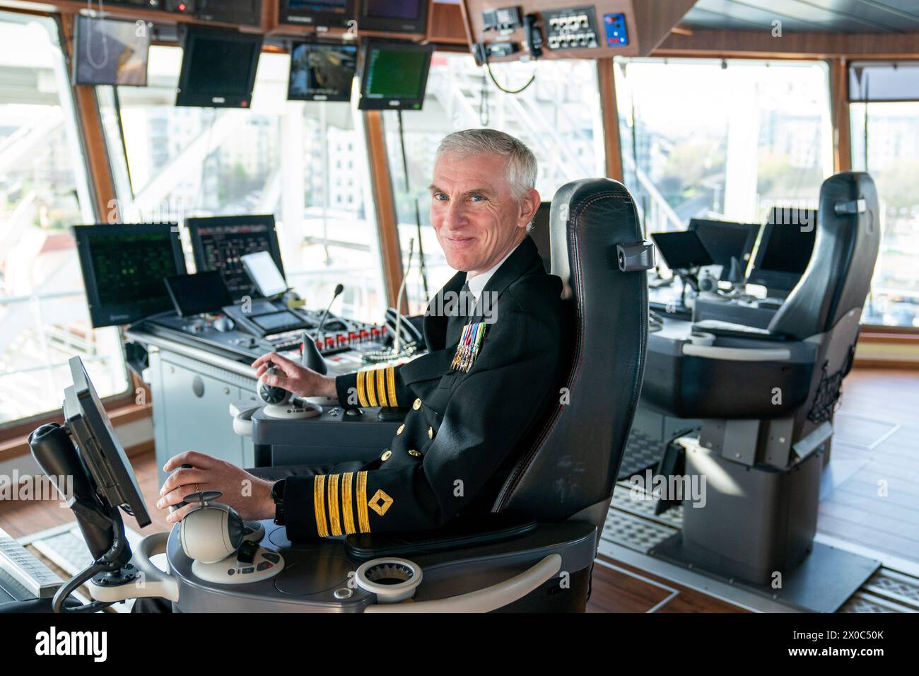 Commanding Officer Captain Duncan Vernoum on the bridge ahead of the ...