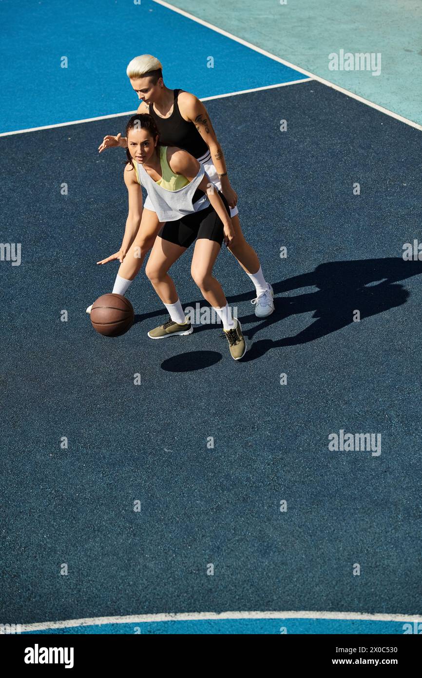 Outdoor basketball court players sun hi-res stock photography and ...
