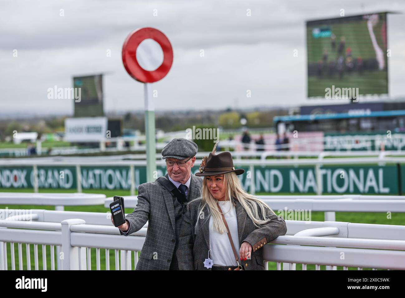 Race goers take a selfie at the finish line during the Randox Grand ...