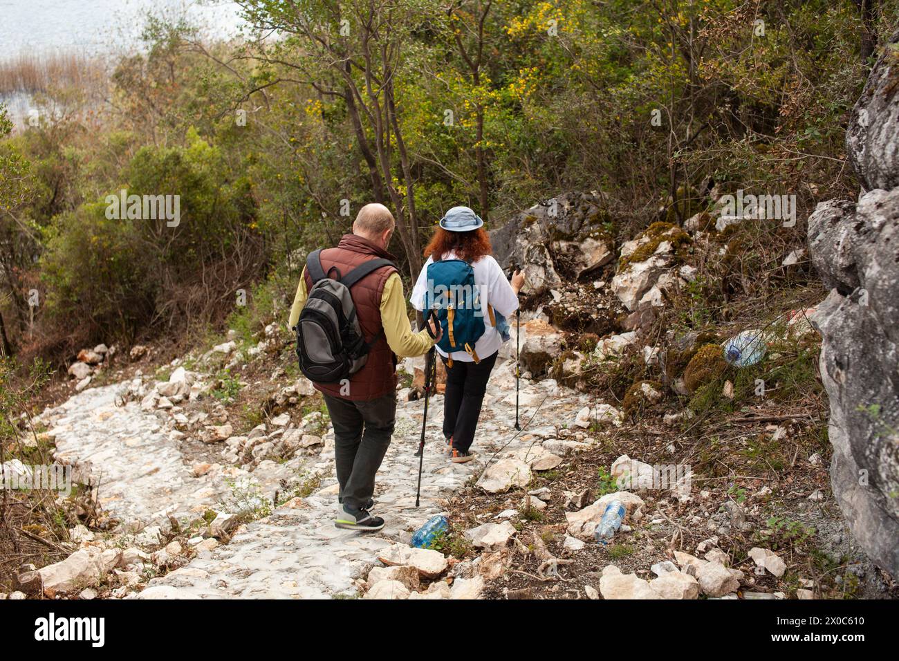 senior couple hiking outdoor, man and woman norwegian walking with sticks Stock Photo - Alamy