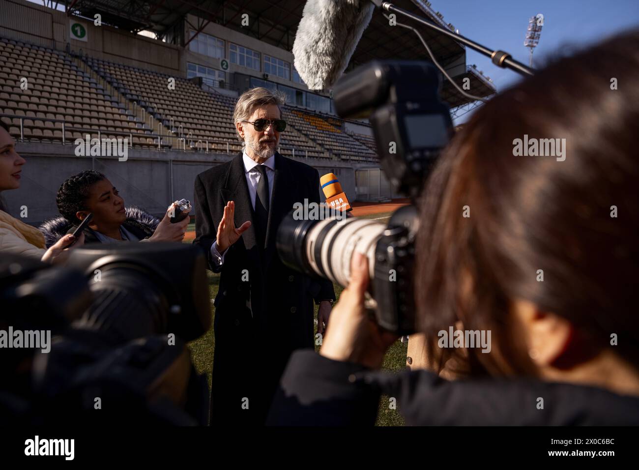 Interview of football team director at press conference for TV news ...