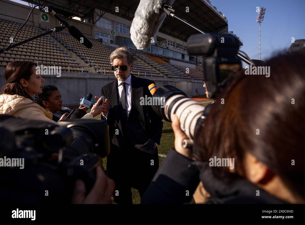 Interview of football team director at press conference for TV news ...