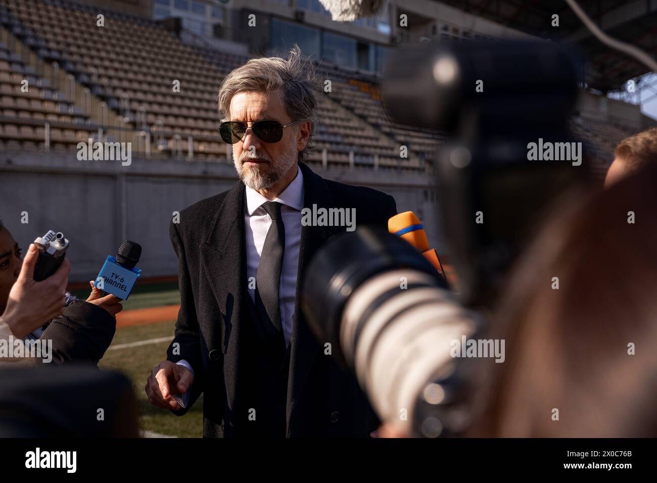 Interview of football team director at press conference for TV news ...