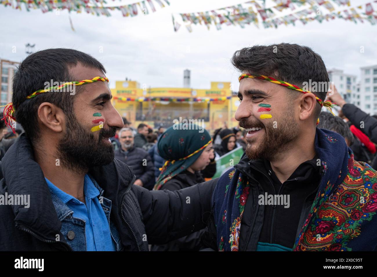 Two young men are seen with painted flags on their faces during a rally ...