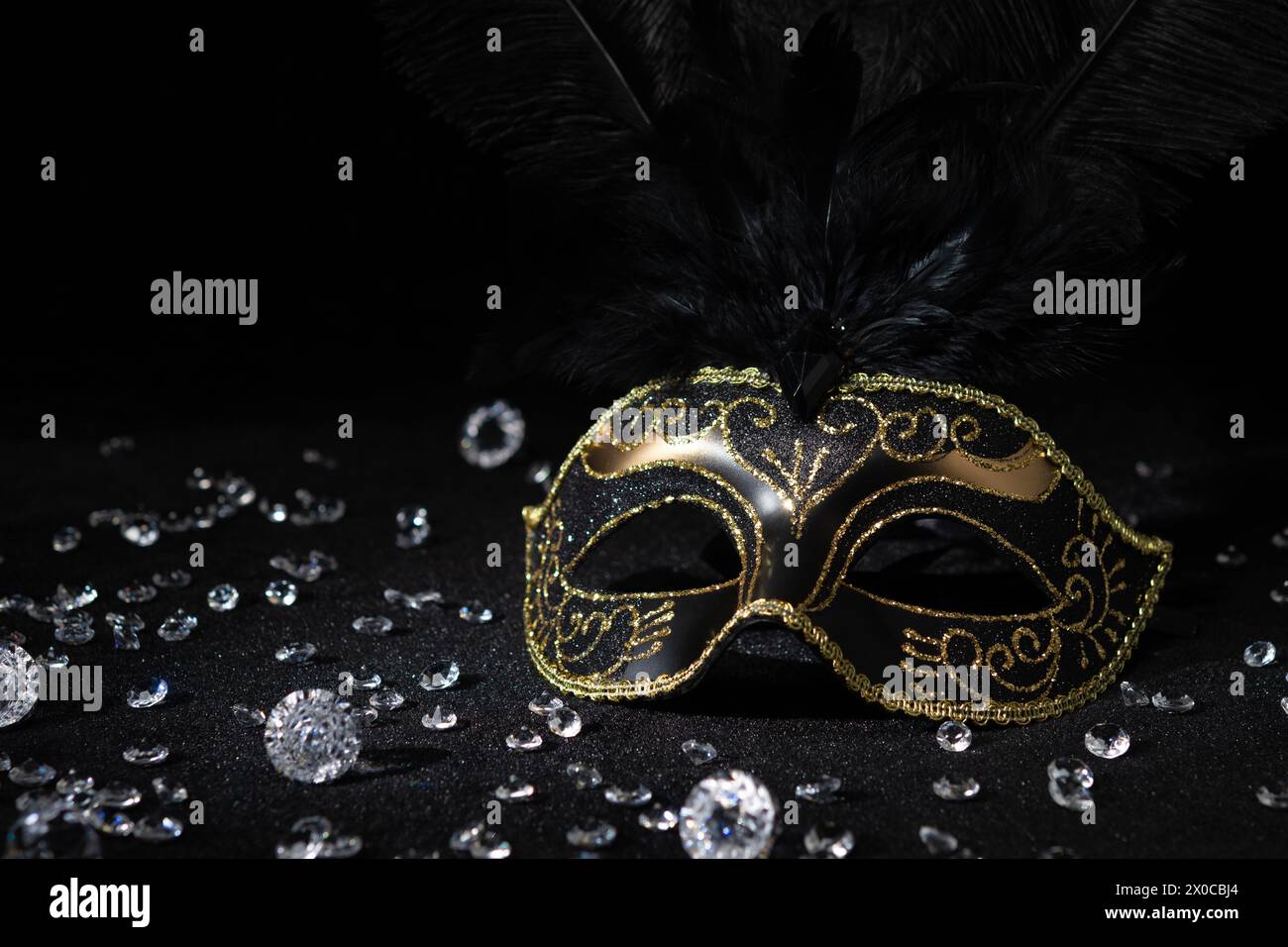 Carnival gold mask with diamonds on black background Stock Photo - Alamy