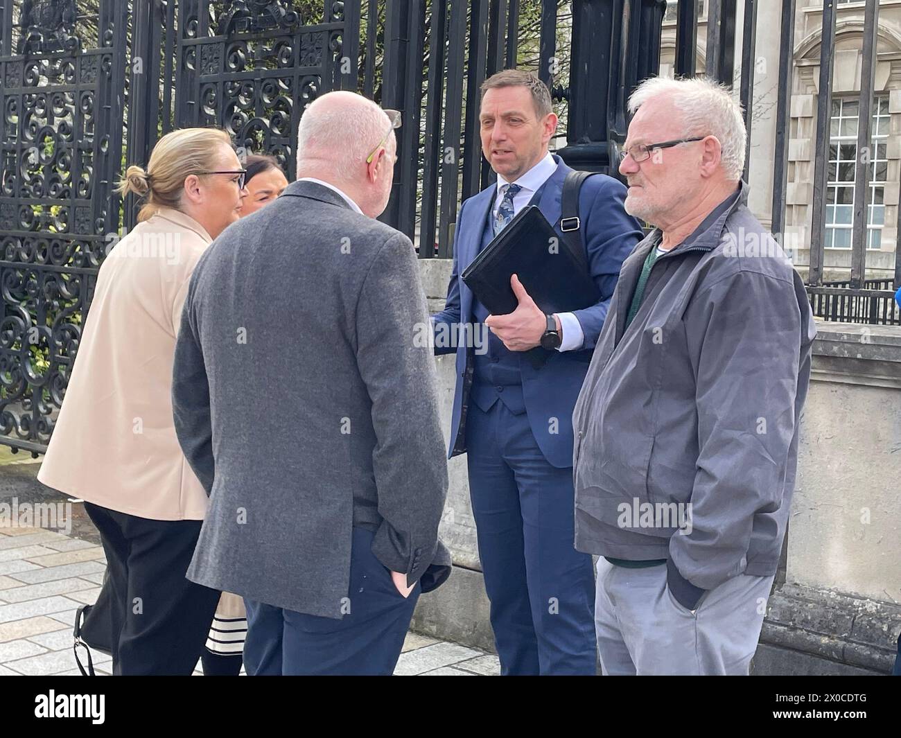 Solicitor Padraig O Muirigh (centre) with members of the families of ...