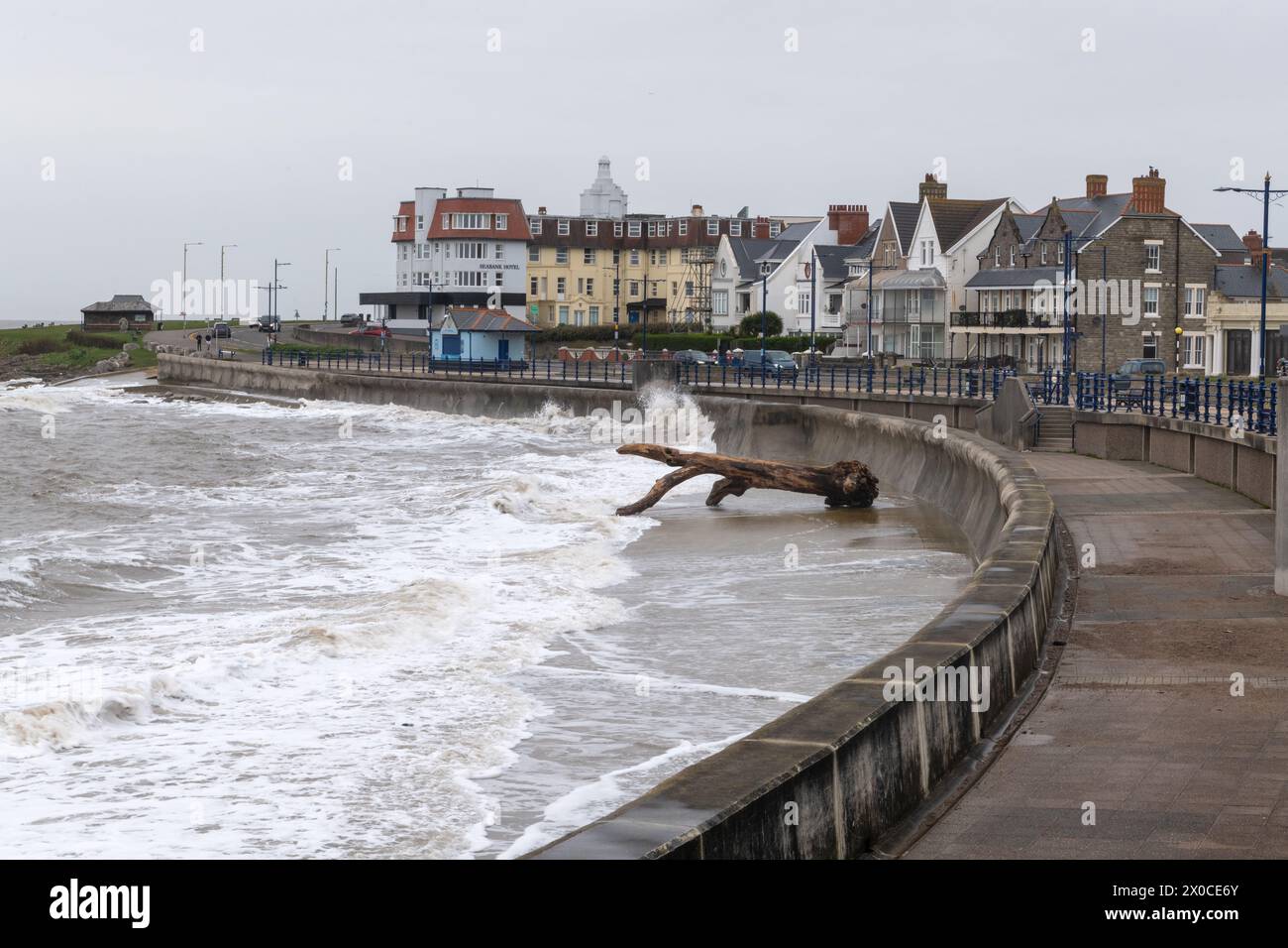 Storm waves crash against Porthcawl promenade as driftwood is thrown ...