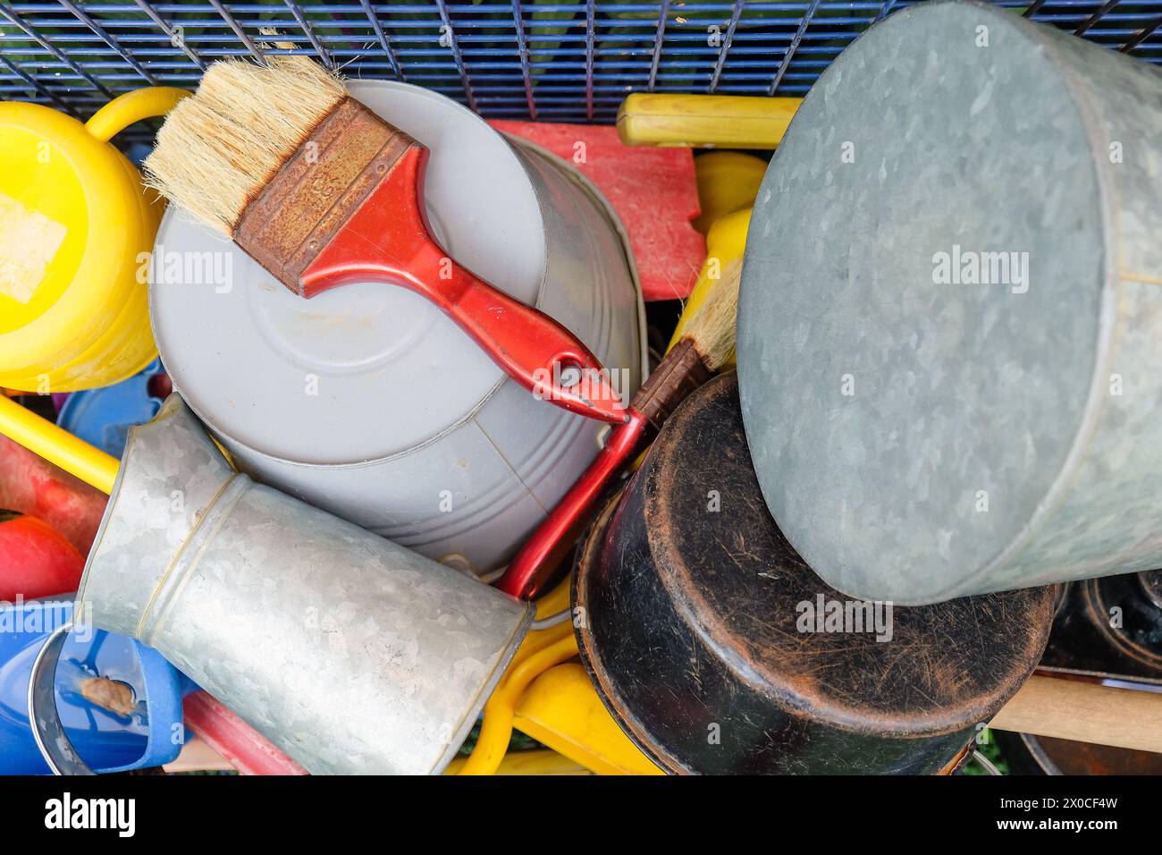 Colorful array of common household items and tools in a disorganized ...