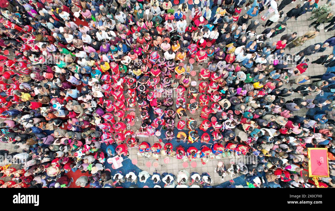 LIUZHOU, CHINA - APRIL 11, 2024 - People of various ethnic groups sing ...
