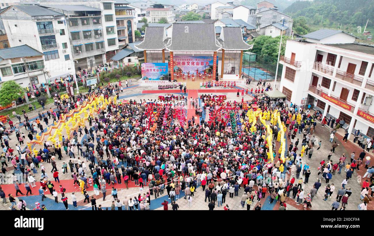 LIUZHOU, CHINA - APRIL 11, 2024 - People of various ethnic groups sing ...