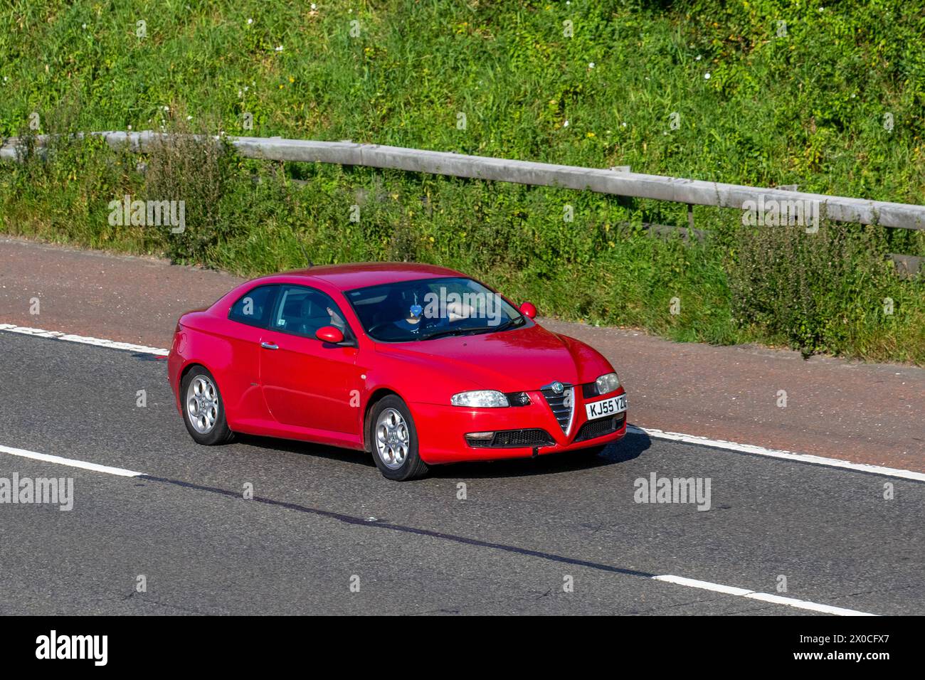 2005 Red Alfa Romeo GT 1.9 JTDm 16V Lusso 2d sports car travelling on ...