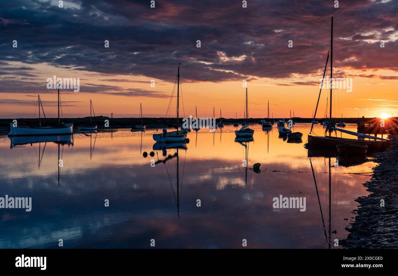 Boats in the harbour at Burnham Overy Staithe, Norfolk, England Stock ...