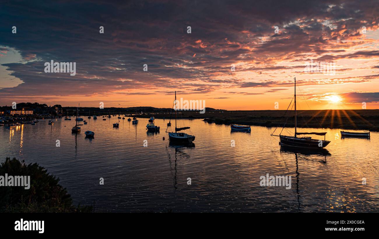Boats in the harbour at Burnham Overy Staithe, Norfolk, England Stock ...