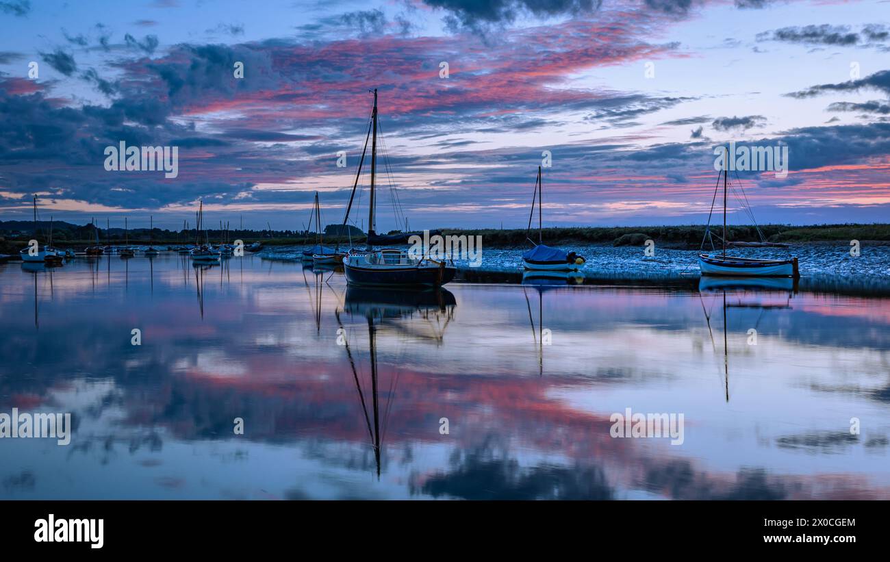 Boats in the harbour at Burnham Overy Staithe, Norfolk, England Stock ...