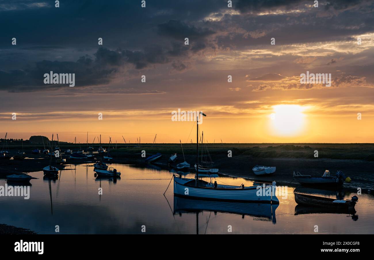 Sunset over the harbour at Burnham Overy Staithe Stock Photo - Alamy
