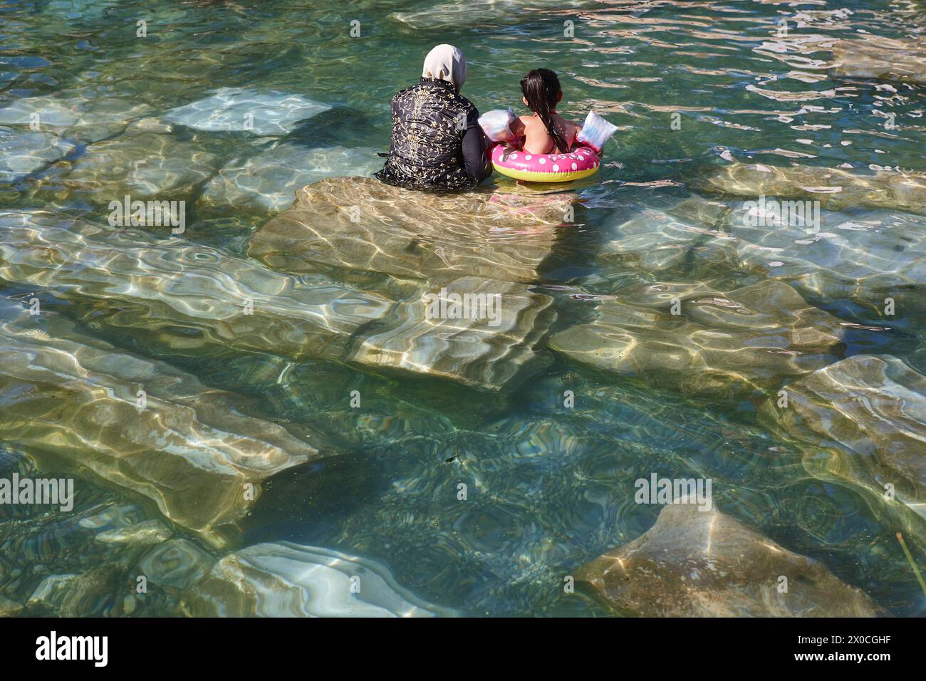 Thermal pool in archeological site of Hierapolis. Pamukkale landmark ...