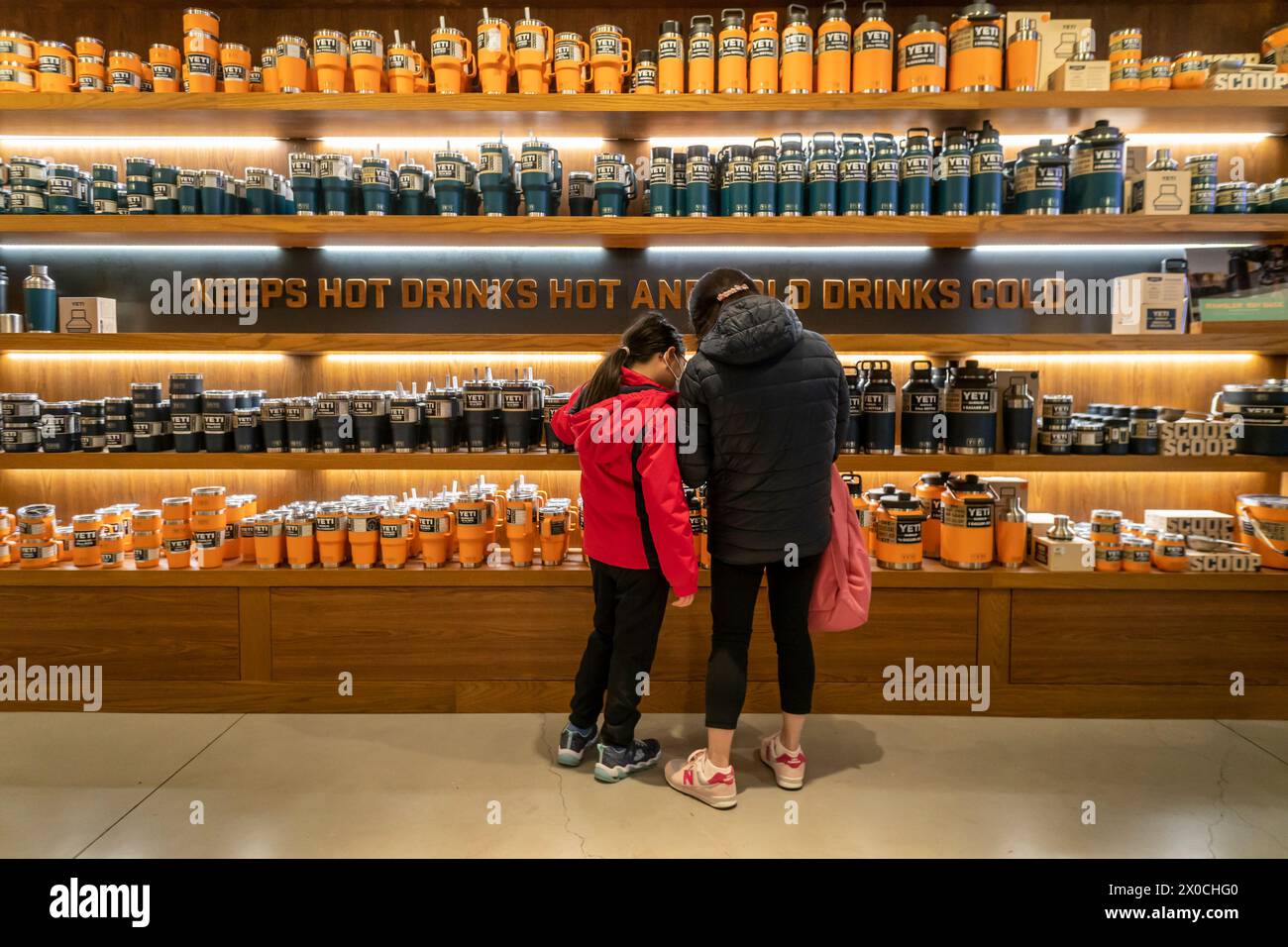 Customers browse merchandise at the grand opening of the Yeti store in ...
