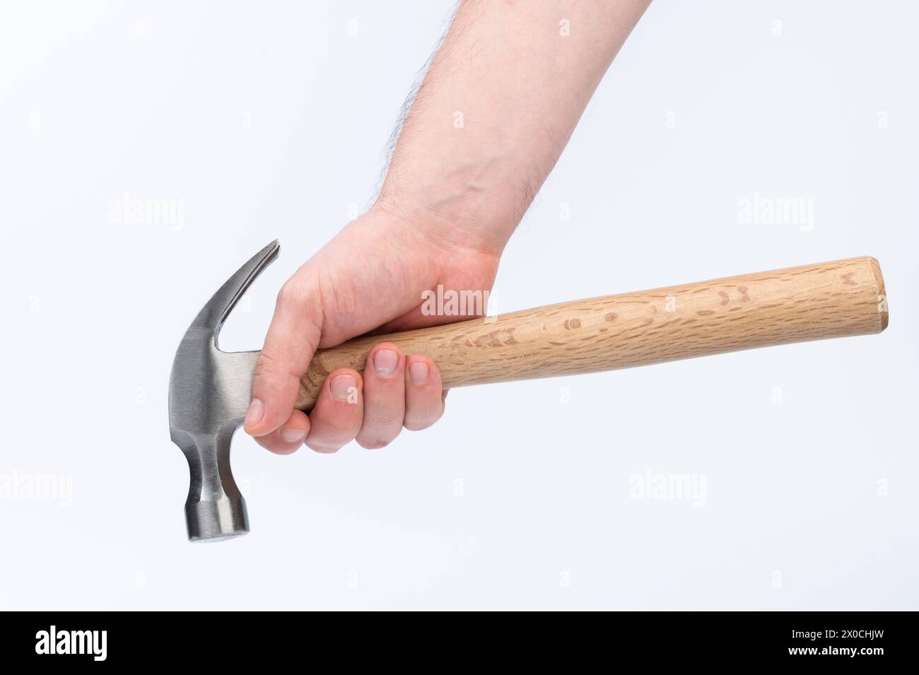New hammer in man hand side view isolated on white studio background ...