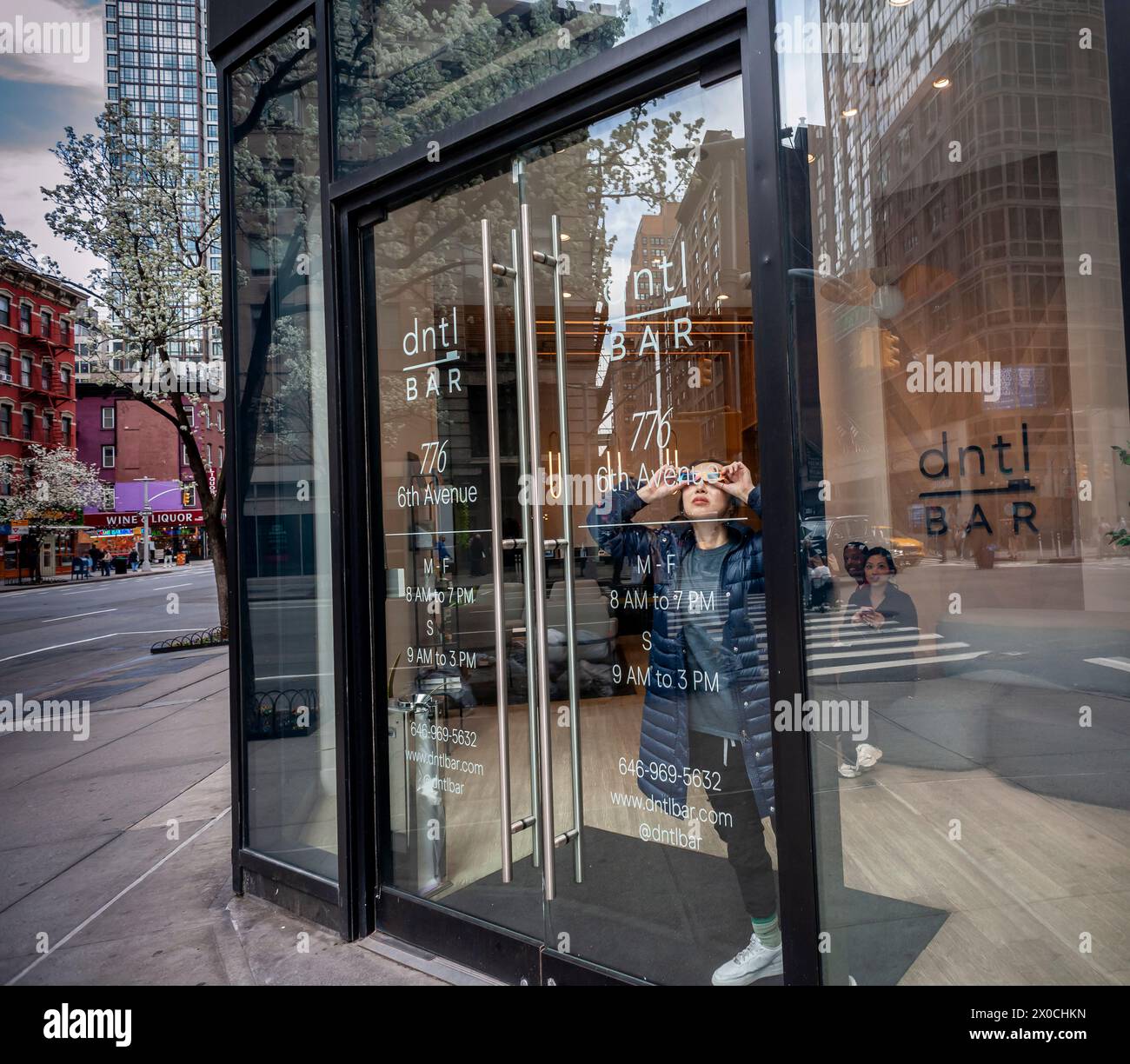 Woman in a dental office watches the solar eclipse on Monday, April 8 ...