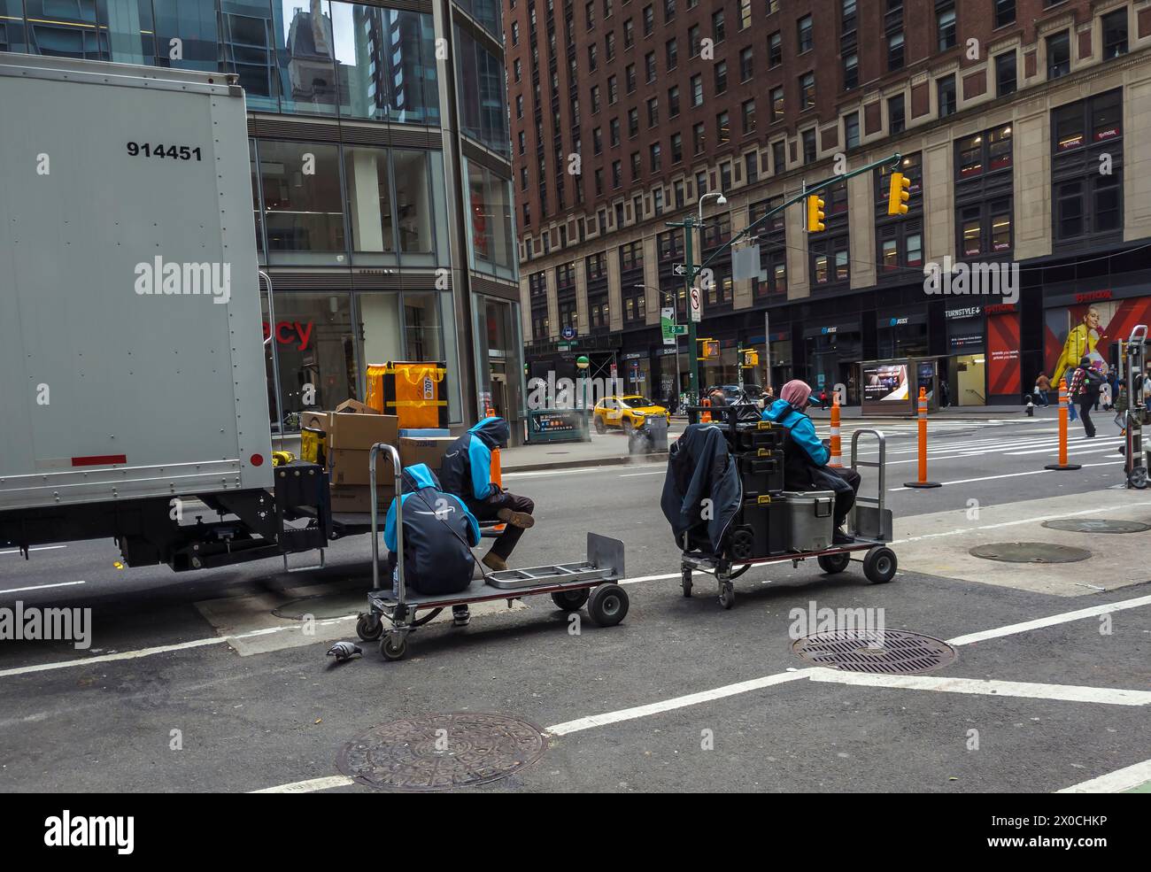Amazon workers prior to making deliveries, in the street in Midtown ...