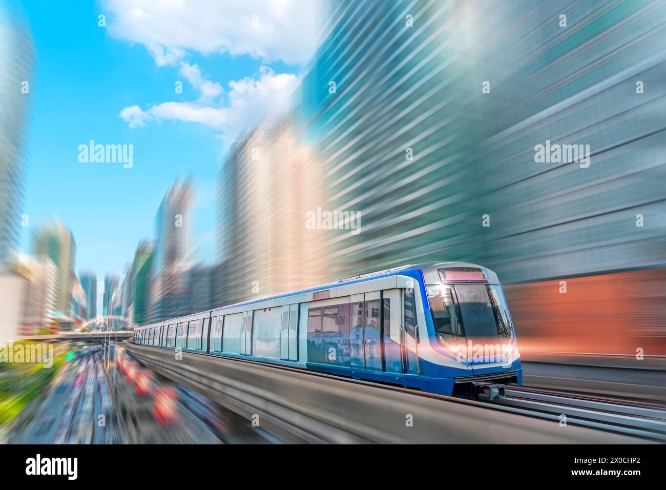 Modern high speed train over ground on a bridge on stilts among ...