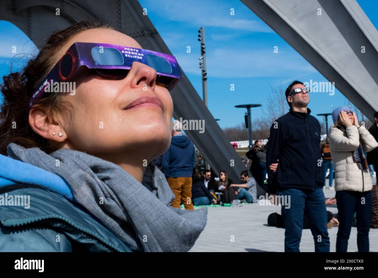 Woman watching the solar eclipse in Montreal, Canada April 2024 Stock ...