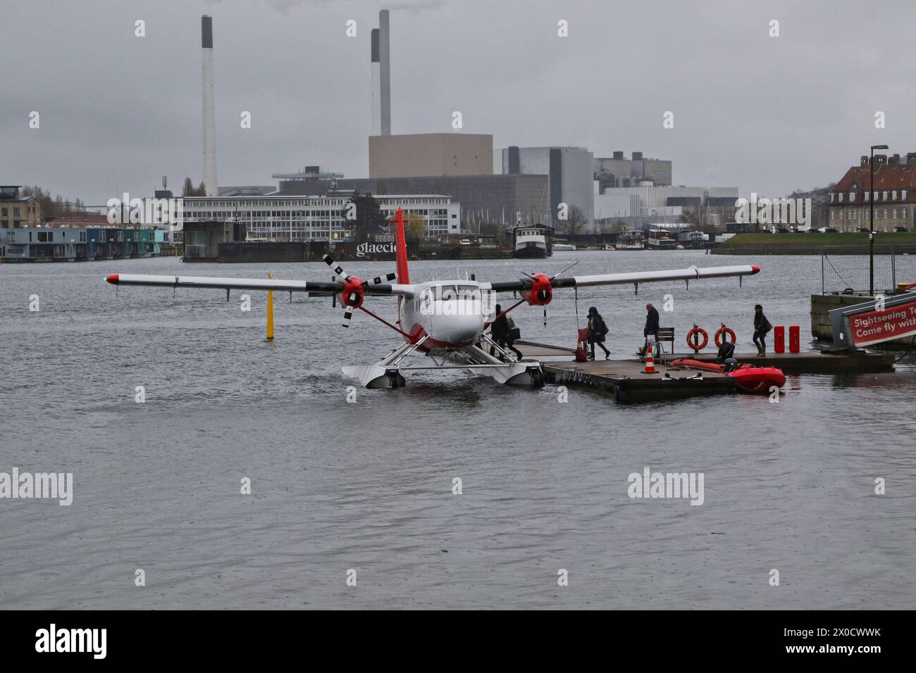 Passengers boarding red and white float plane Copenhagen Denmark April ...