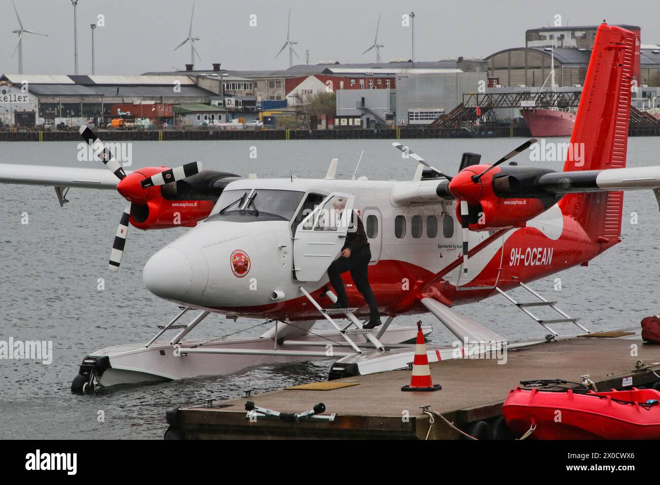 Pilot boarding red and white float plane Copenhagen Denmark April 2024 ...
