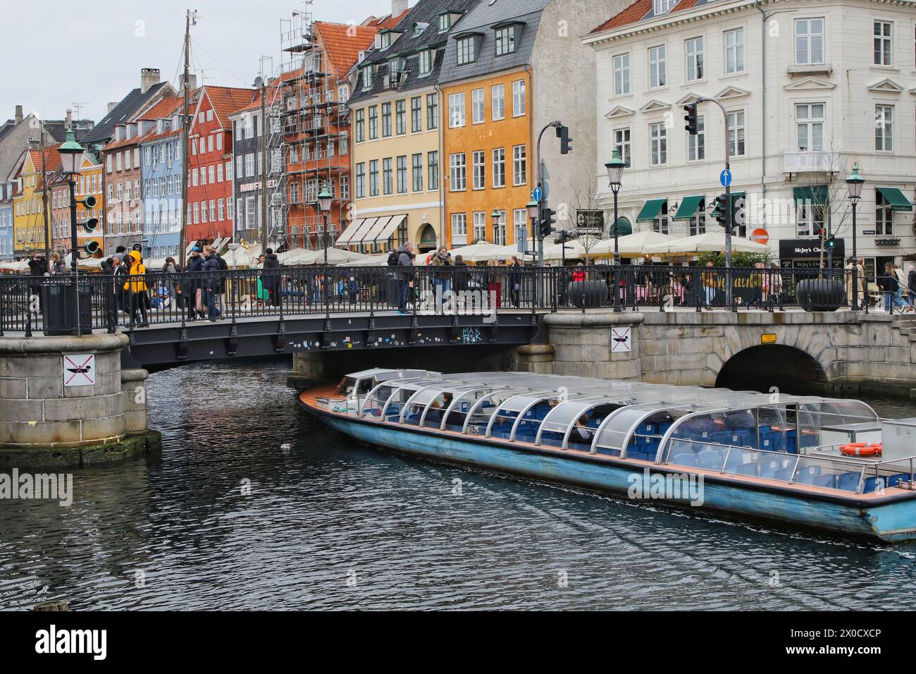 Canal tours Copenhagen boat passing under Nyhavnsbroen bridge Nyhavn ...