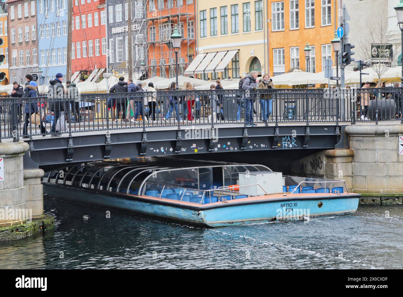 Canal tours Copenhagen boat passing under Nyhavnsbroen bridge Nyhavn ...