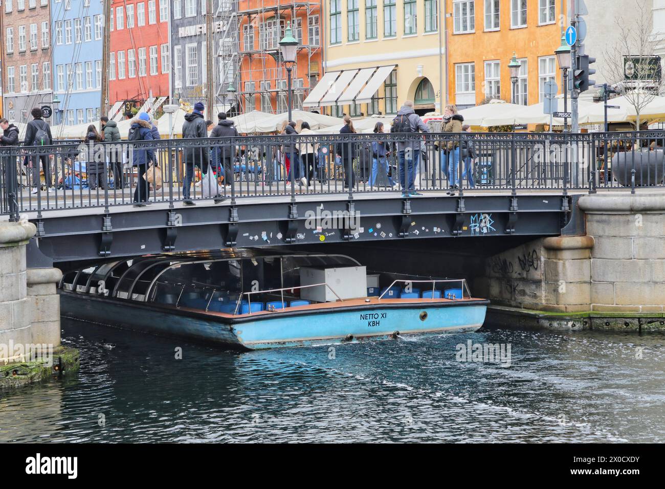 Canal tours Copenhagen boat passing under Nyhavnsbroen bridge Nyhavn ...