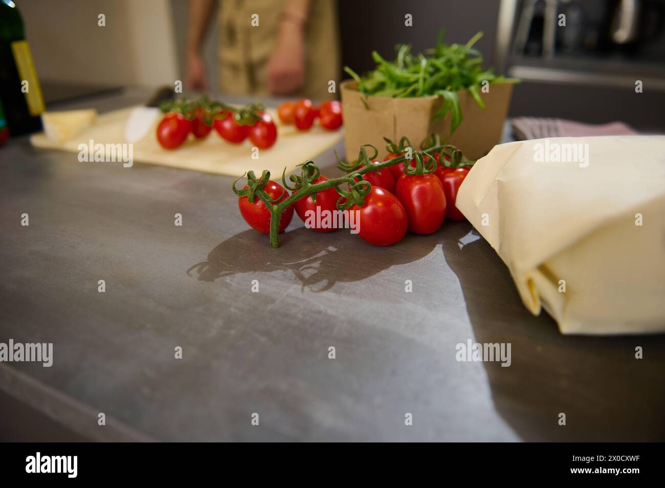A bunch of sweet ripe organic tomato cherry on the kitchen counter Stock Photo - Alamy