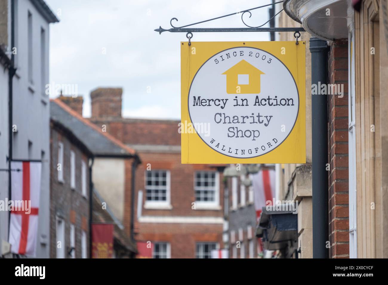 Mercy in Action Charity shop sign Stock Photo - Alamy