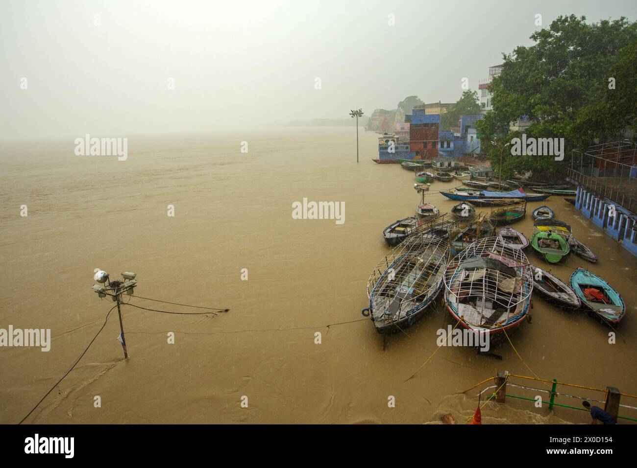 High water of the Ganges River during a monsoon rain at Varanasi, India ...