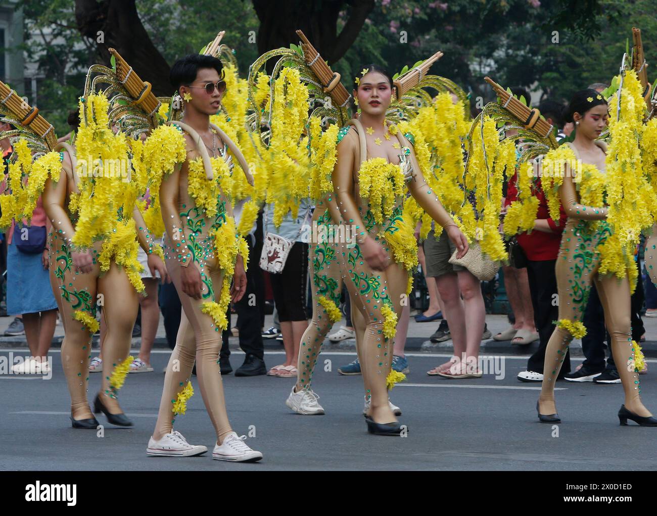 Performers in costumes take part in a parade during the celebration of ...
