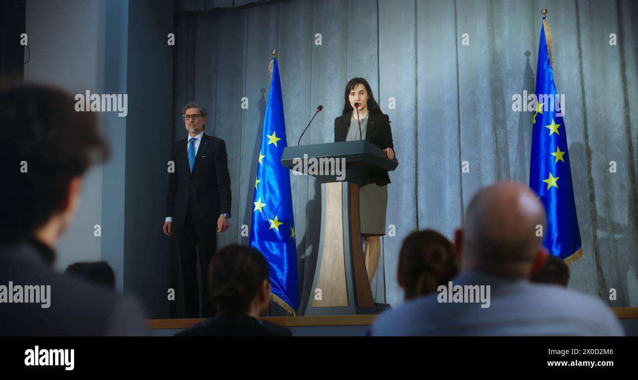Female politician comes to tribune, delivers campaign speech, answers ...