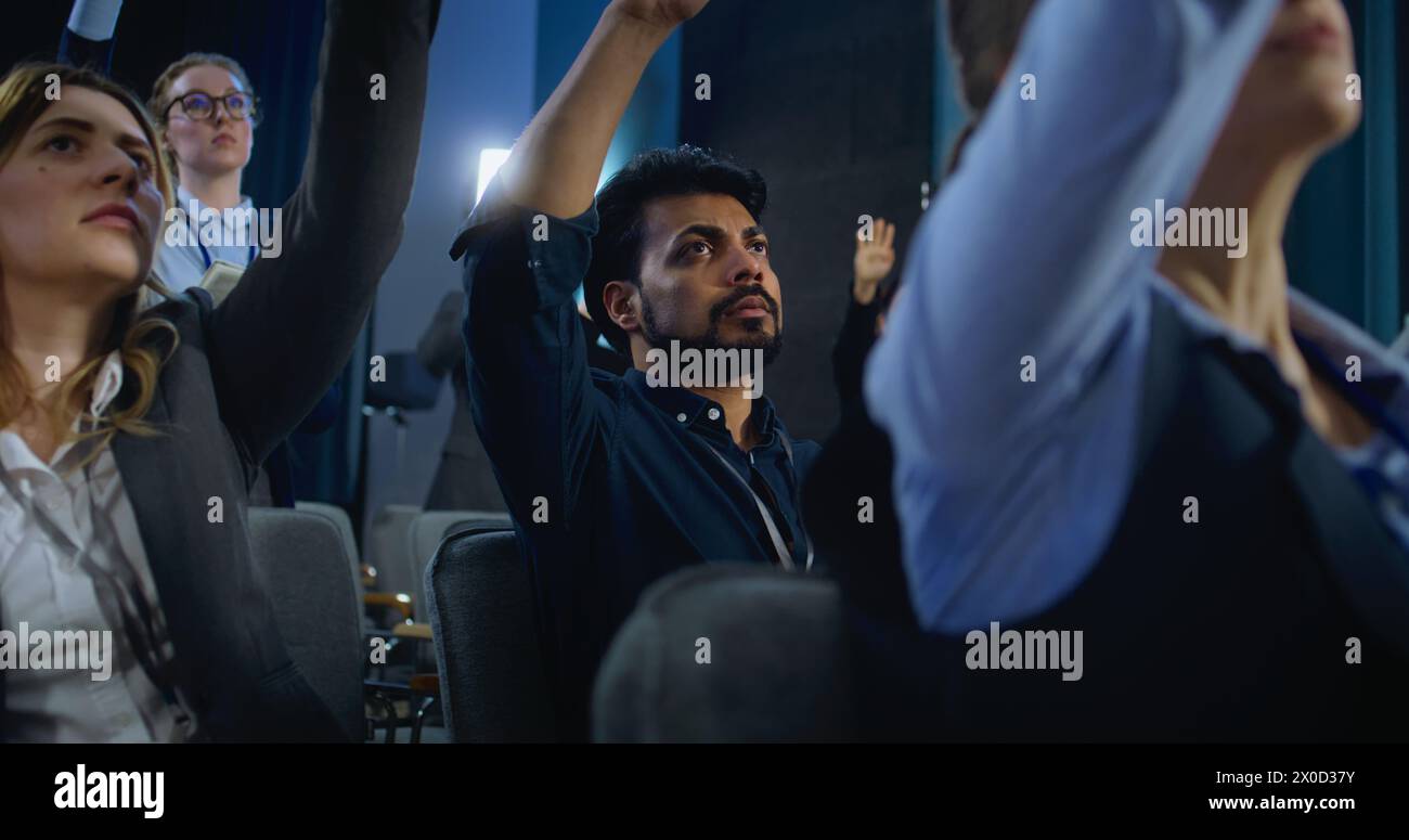 Indian male media representative raises hand and asks question during ...