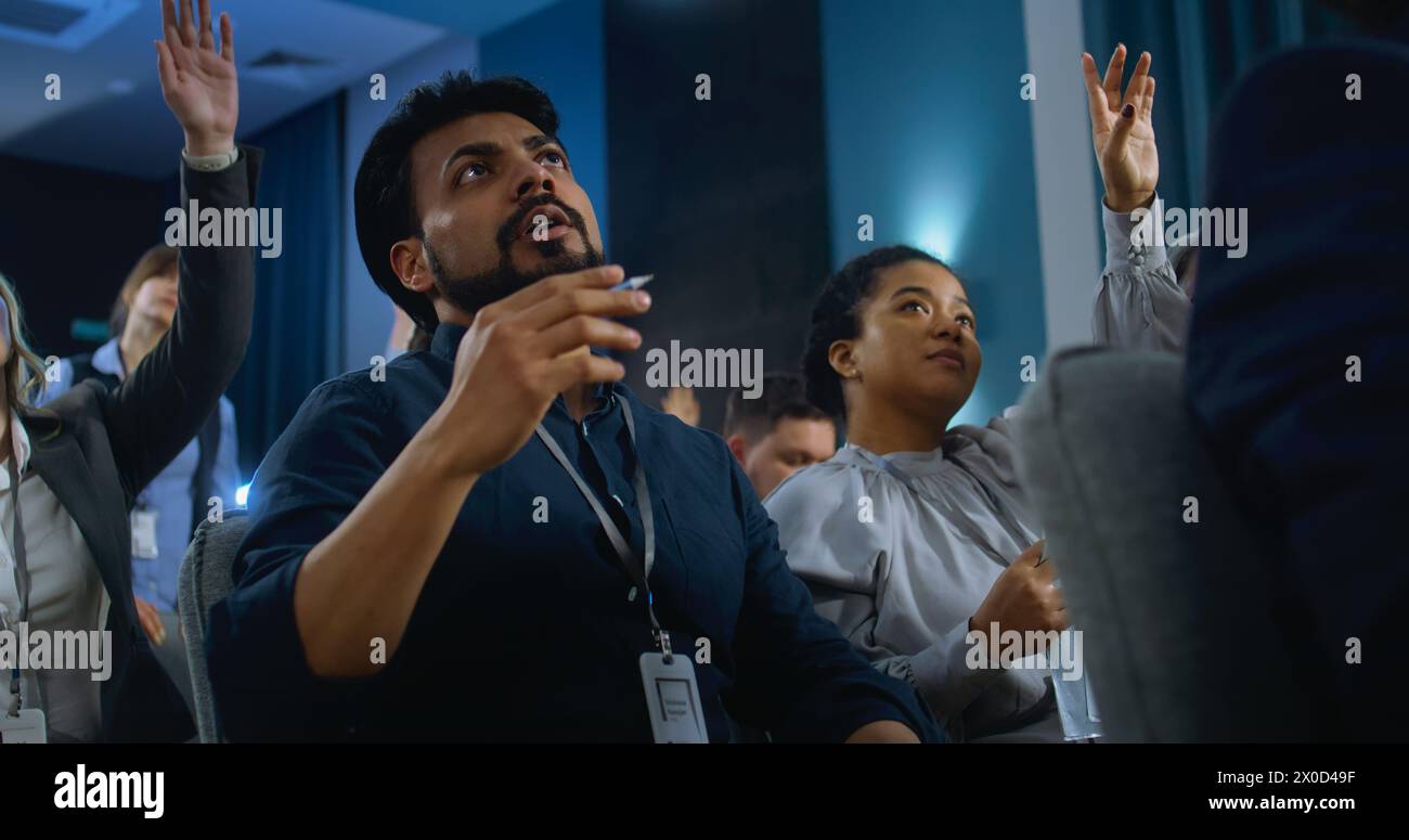 Multiethnic press workers sit in the conference room. Indian male ...