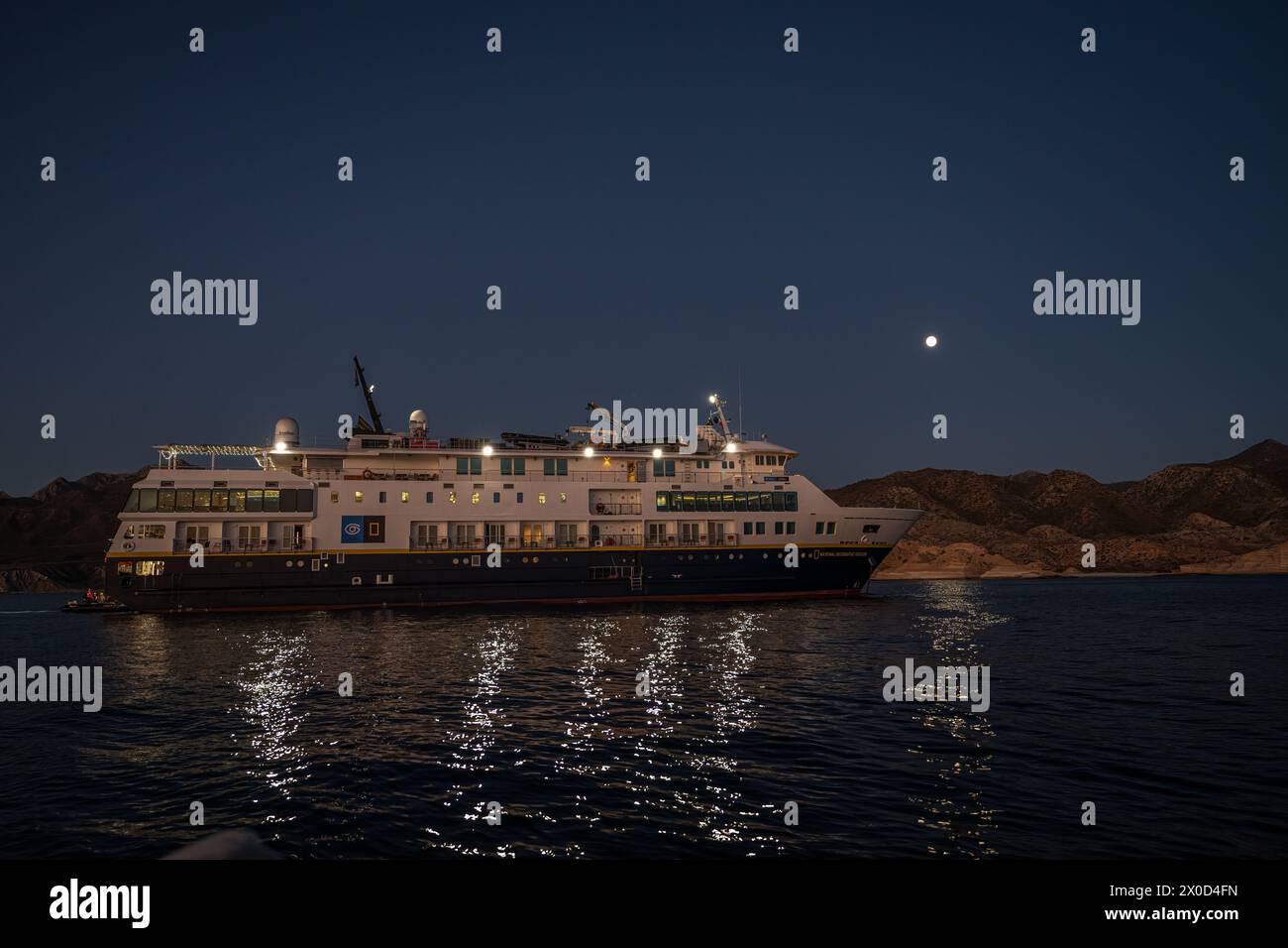 The National Geographic Venture cruise ship at anchor shortly after ...