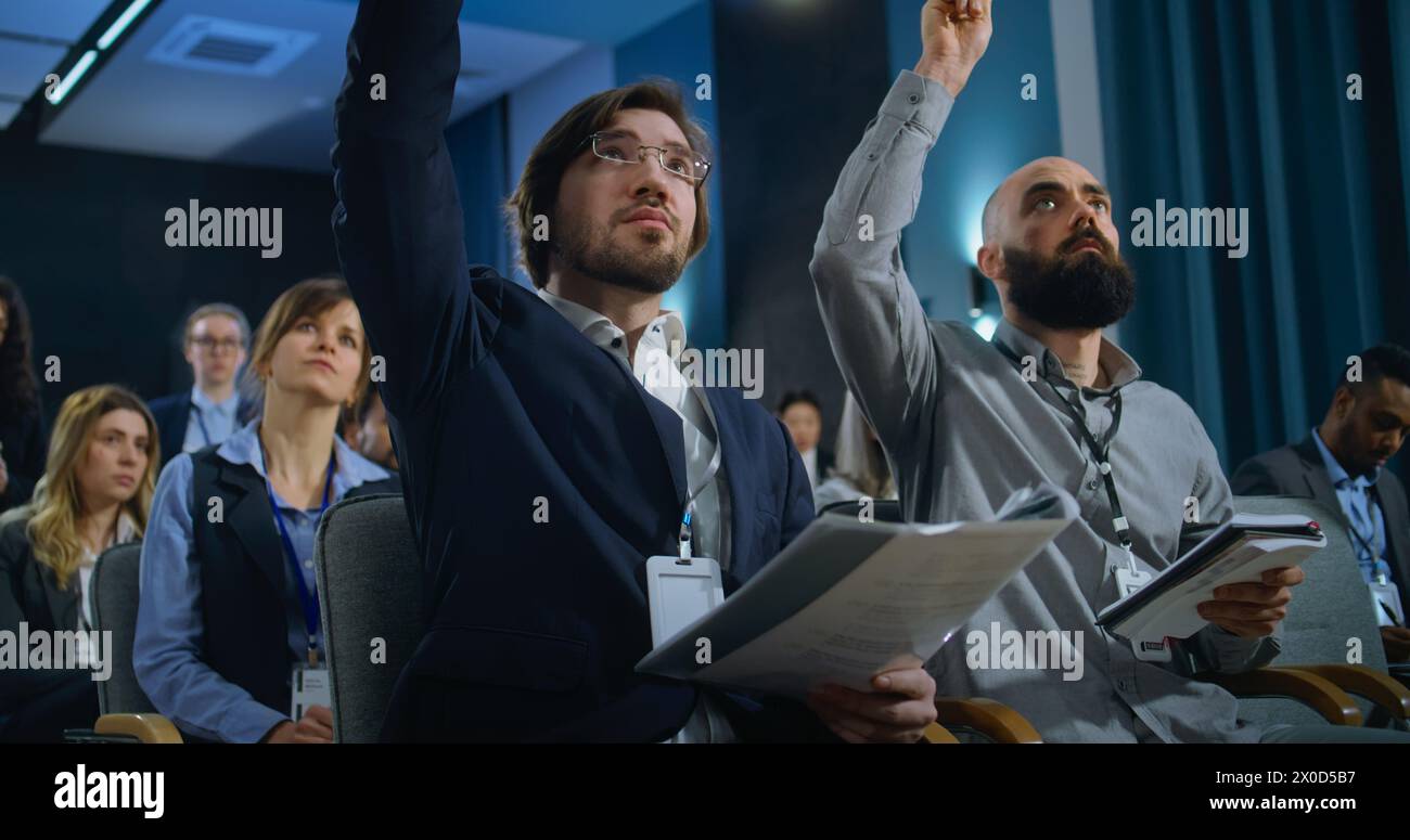 Journalists sit and write answers in notebooks from politician during ...