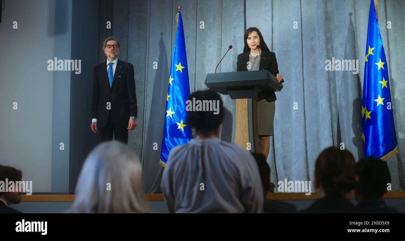 Female politician comes to tribune, delivers campaign speech, answers ...