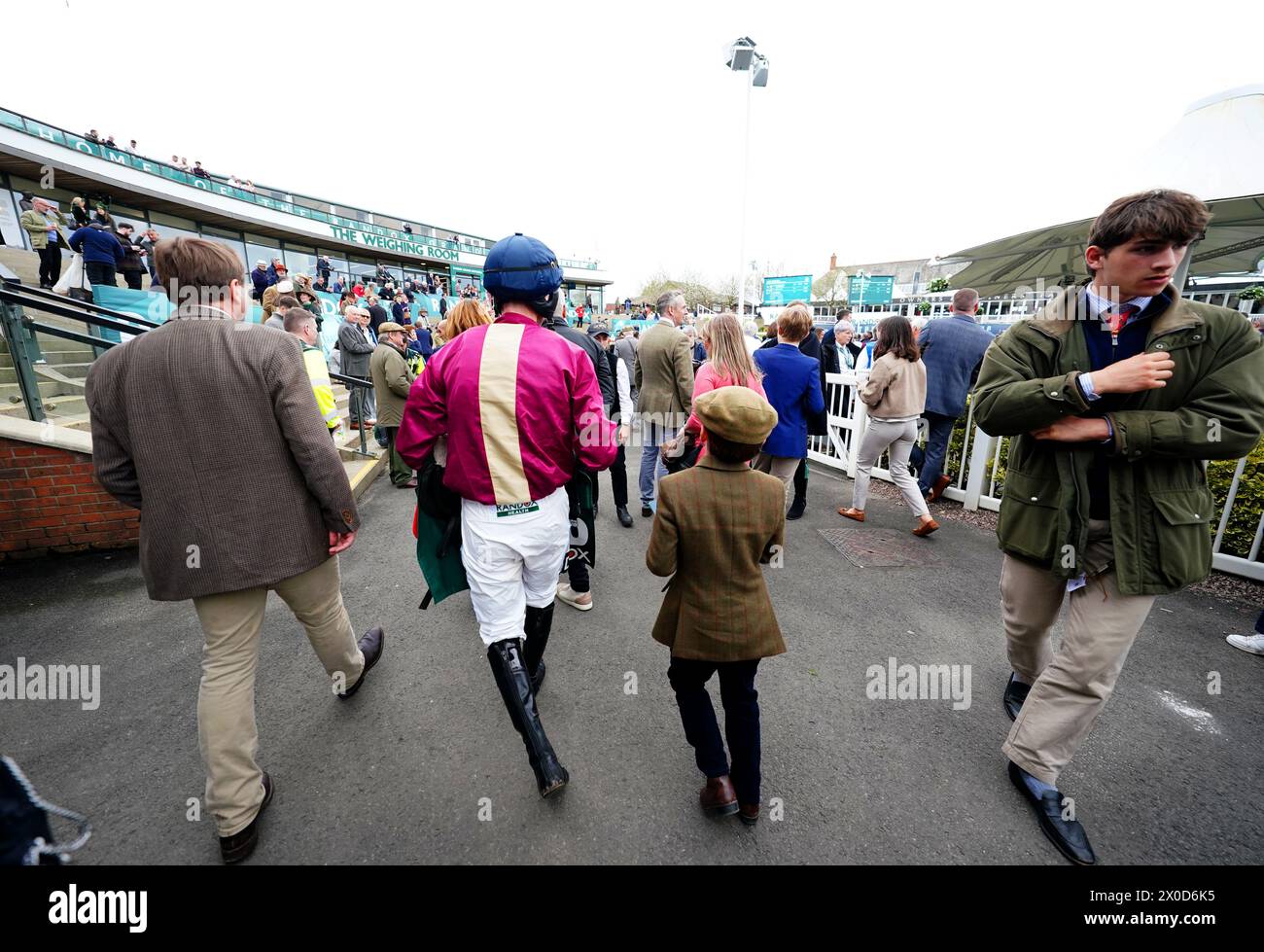Jockey Daniel Cherriman (left) makes his way back after competing in ...