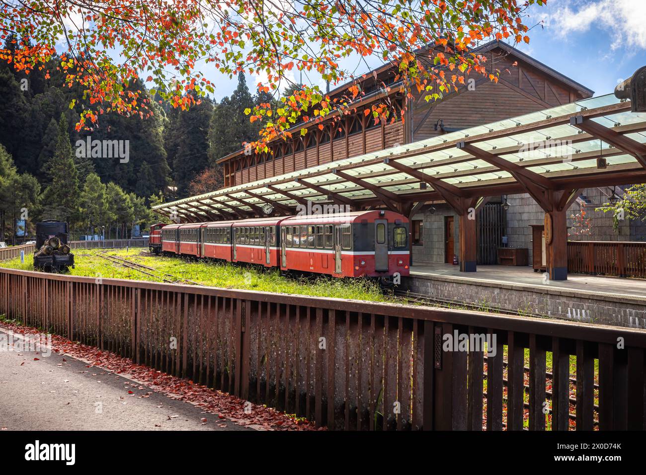 Colorful Japanese autumn vibe of a train station in the Alishan forest ...