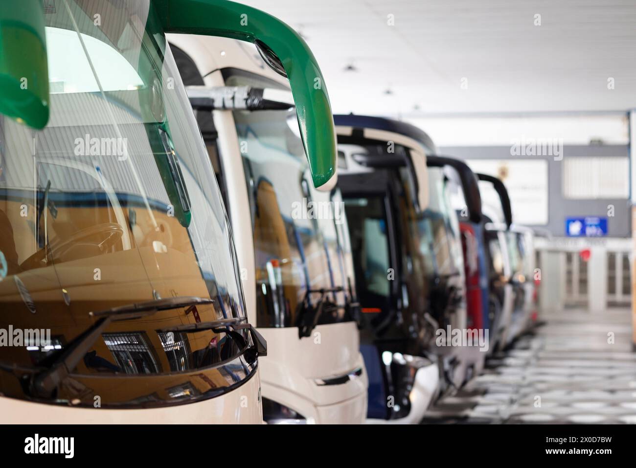 Row of parked passengers buses on the station Stock Photo - Alamy