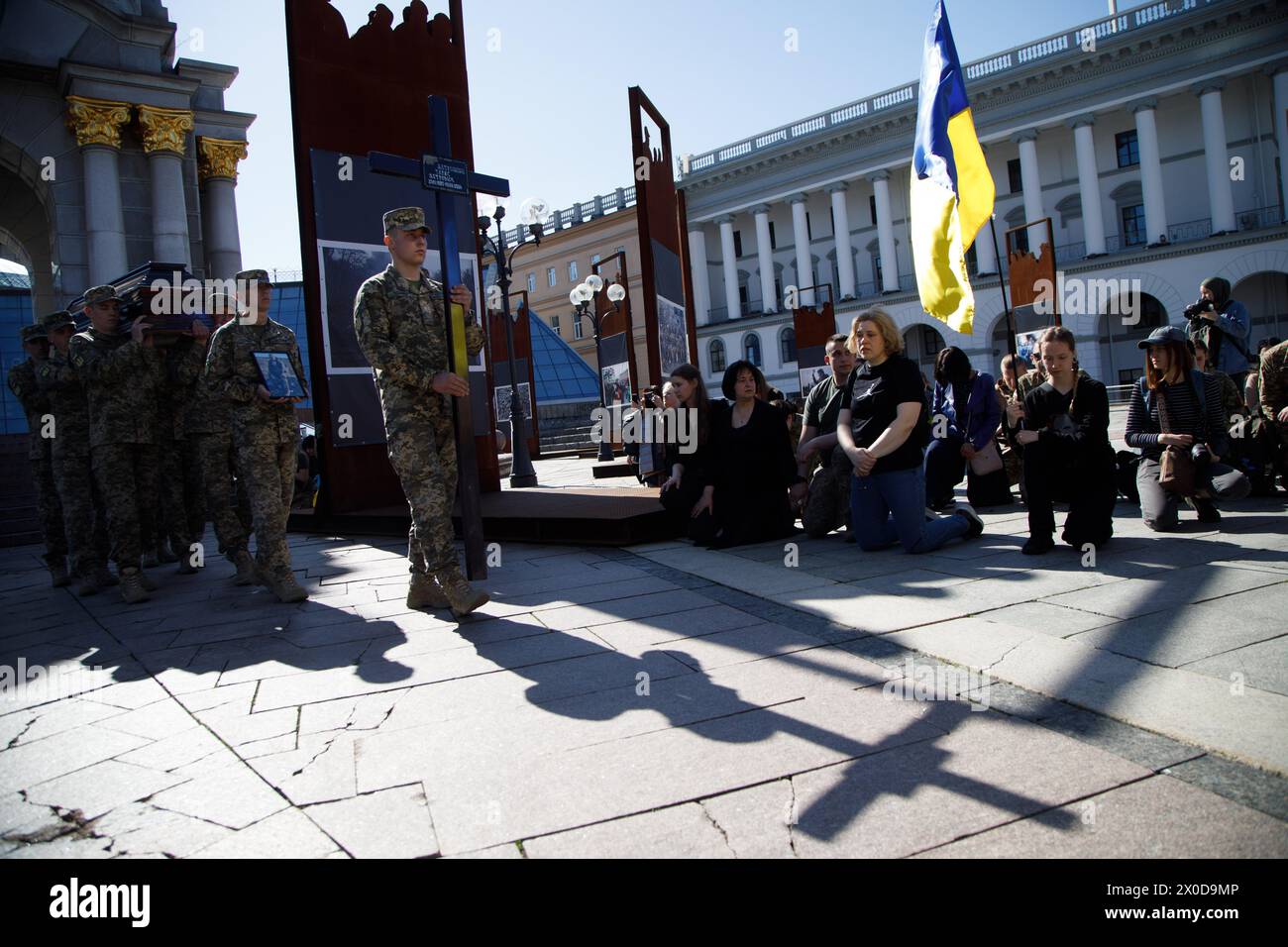 Non Exclusive: KYIV, UKRAINE - APRIL 9, 2024 - People kneel to express ...