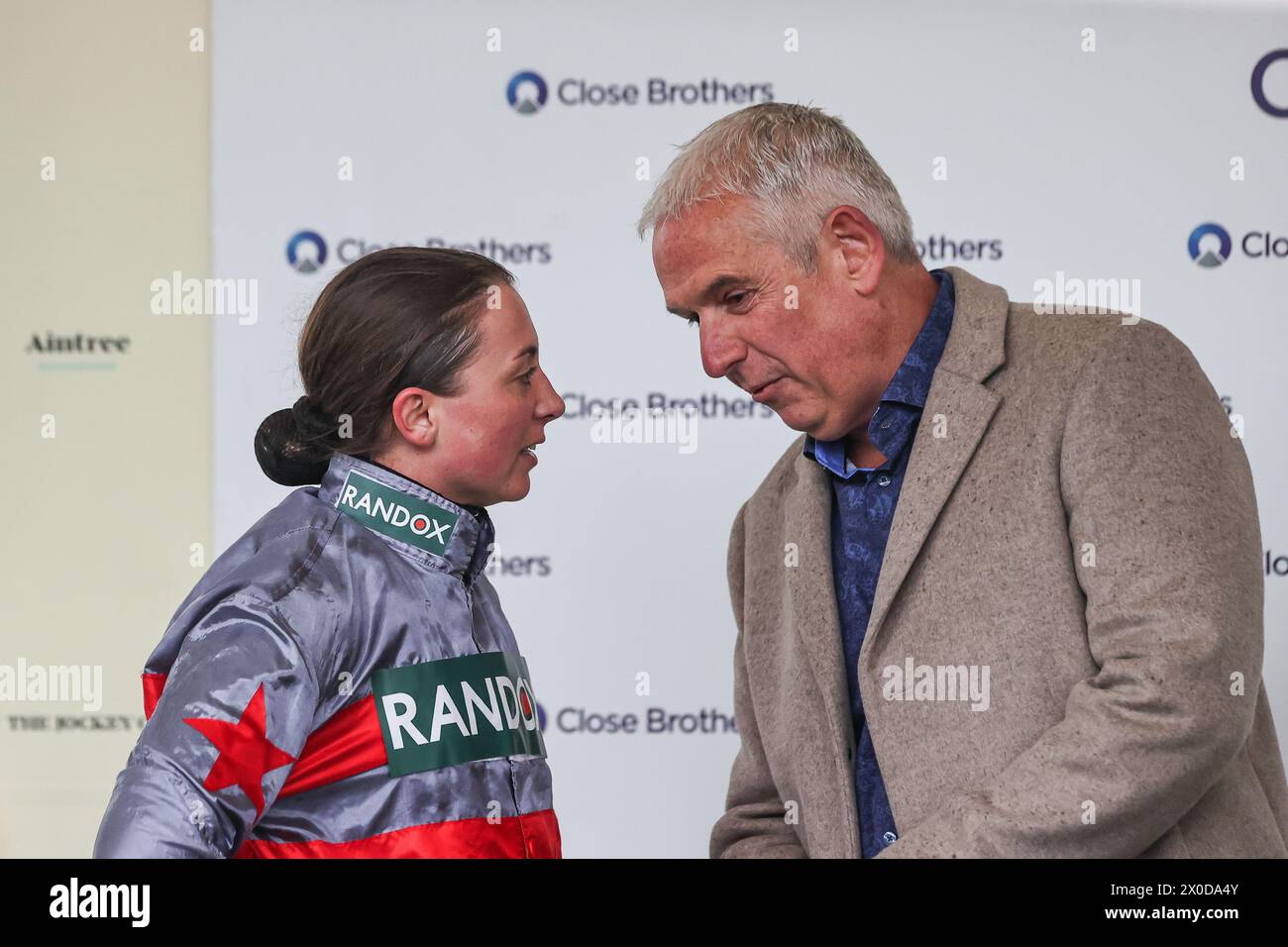 Bryony Frost chats to horse owner Mr Andy Peake after winning the 4 ...