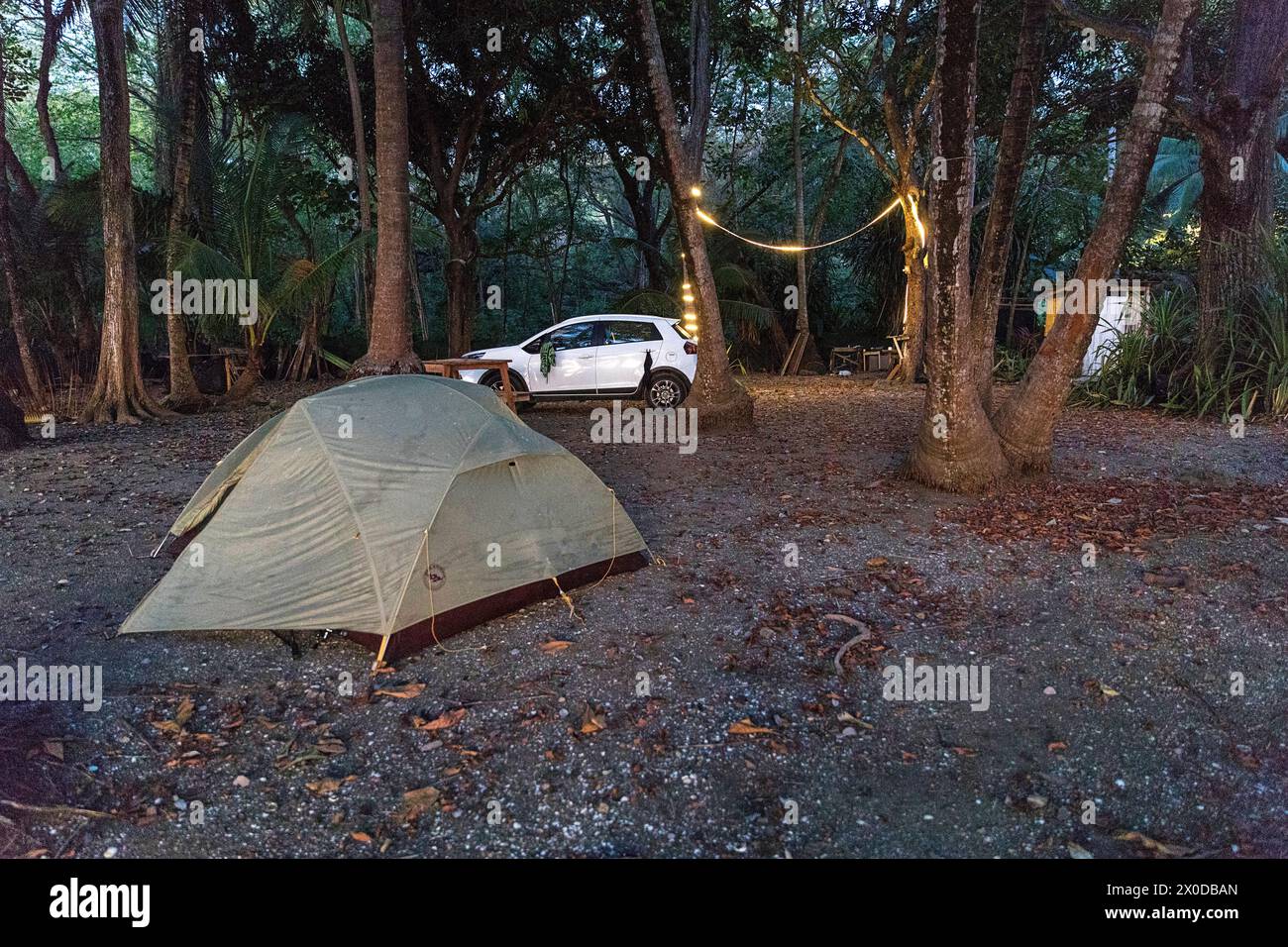 Small tent and car on idyllic campground near the small tourist village ...